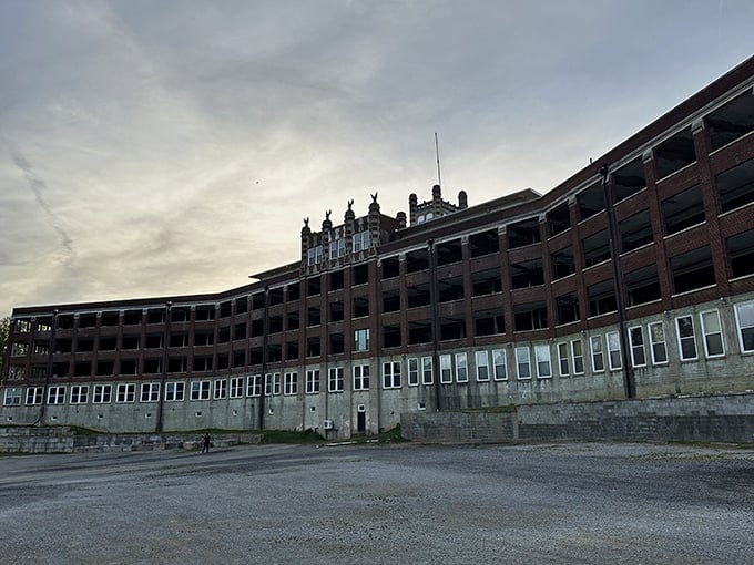 The imposing brick facade of Waverly Hills stands as a silent sentinel, its windows like countless eyes watching your approach with century-old patience.