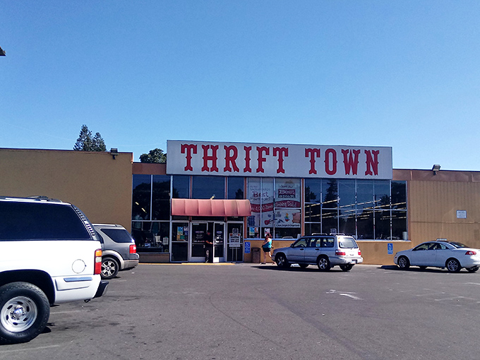 The iconic red Thrift Town sign beckons like a lighthouse for bargain hunters. Sacramento's temple of thrift stands ready for treasure seekers of all budgets.