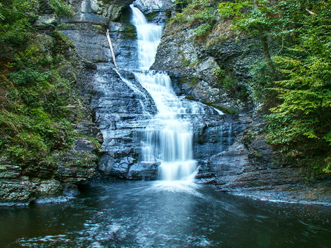 The entrance sign to paradise doesn't need neon lights. Raymondskill Falls welcomes visitors with rustic charm and the promise of natural wonder ahead. 
