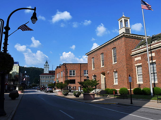 Pikeville's historic downtown showcases classic brick architecture against a backdrop of blue Kentucky skies, where small-town charm meets thoughtful preservation.