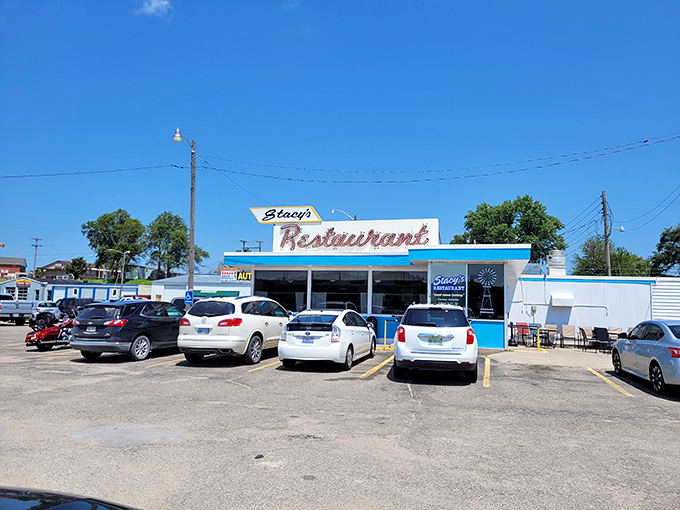 The classic neon sign beckons like an old friend. Stacy's Restaurant stands proudly against the Kansas sky, promising comfort and nostalgia with every meal.