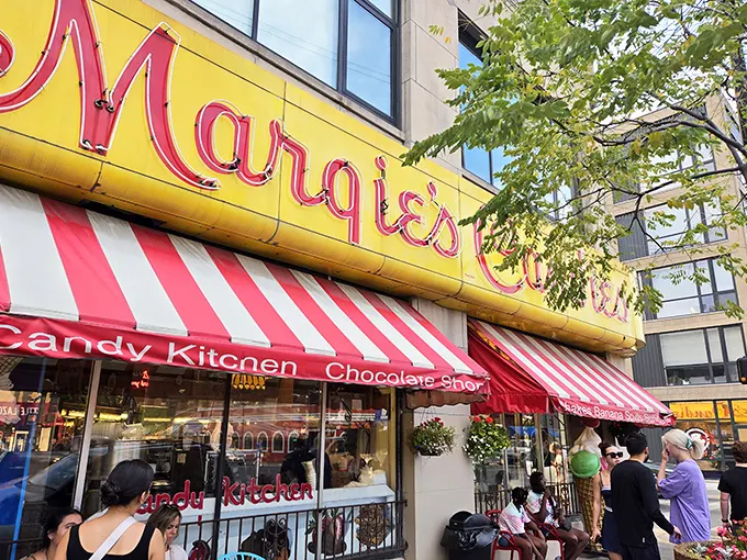 That iconic yellow and red sign beckons like a lighthouse for sweet-toothed sailors navigating the urban seas of Chicago's neighborhoods.
