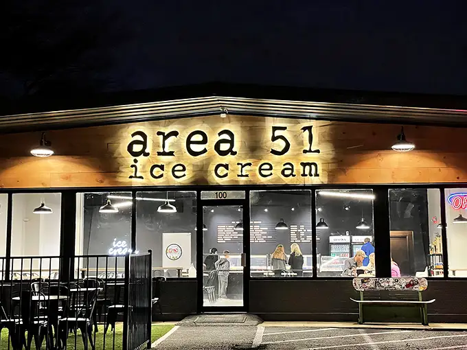 The illuminated wooden facade of Area 51 Ice Cream beckons like a beacon of sweetness in the night. Extraterrestrial delights await inside this unassuming Hernando storefront.