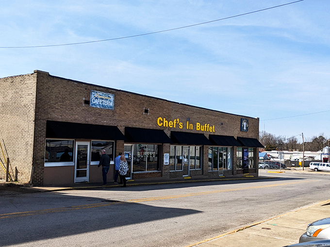 The unassuming brick exterior with bright blue awnings is like a culinary Clark Kent – ordinary on the outside, superhero-level deliciousness within. 