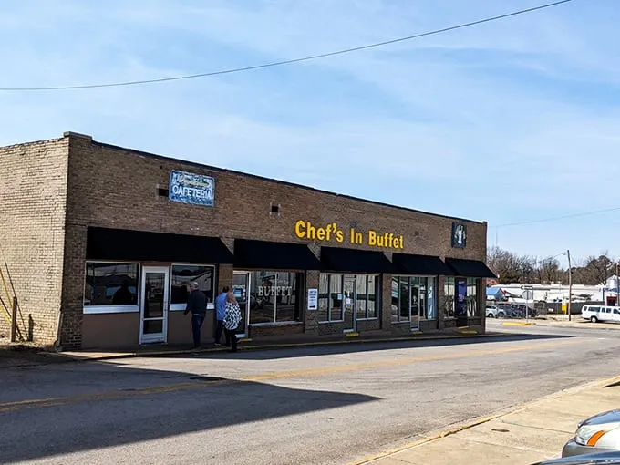 The unassuming brick exterior with bright blue awnings is like a culinary Clark Kent – ordinary on the outside, superhero-level deliciousness within.