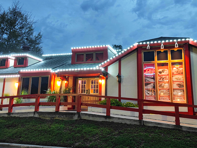 The red-trimmed exterior of Kacey's Buffet glows with promise at dusk, like a beacon calling hungry travelers to a homestyle feast.
