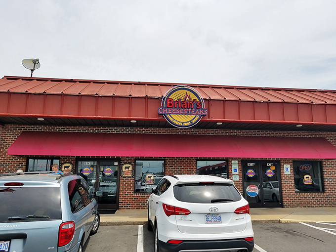 The brick façade might not scream "culinary destination," but that neon sign promises Philly-style satisfaction in the heart of Rocky Mount.