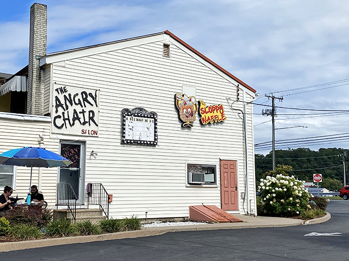 The unassuming exterior of The Sloppy Waffle shares space with The Angry Chair Salon—a pairing that somehow makes perfect sense in Connecticut's charming landscape.