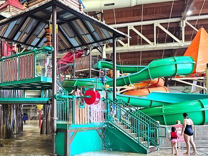 The indoor oasis where summer never surrenders to winter. Lounge chairs stand at attention, ready for parents who'll claim they're "just watching" but secretly yearn for that waterslide plunge.