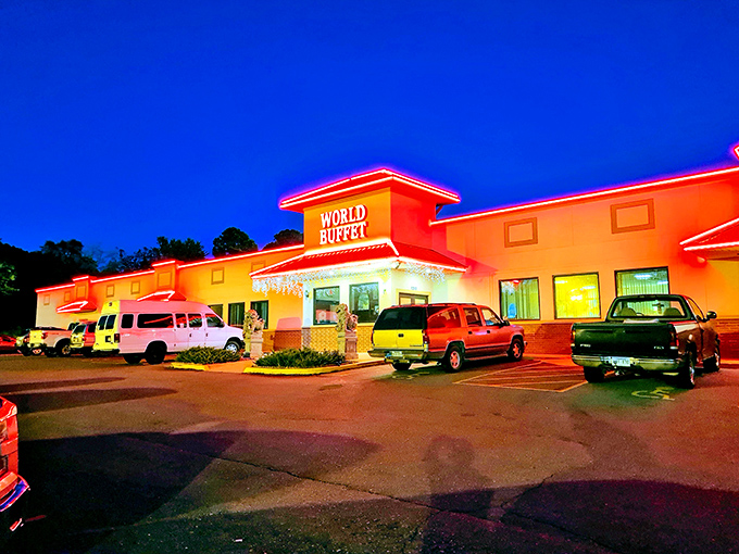 The iconic red-roofed entrance to World Buffet, where stone guardian lions stand sentinel, promising an epic feast within these hallowed walls. 