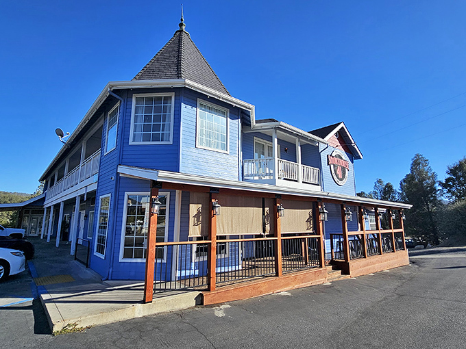 The blue Victorian-style building housing Smokehouse 41 stands like a beacon of barbecue hope in Oakhurst, promising smoky treasures within its welcoming walls.