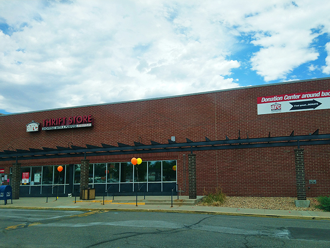 The unassuming brick exterior of arc Thrift Store hides a treasure trove within, like finding a speakeasy but for vintage bargains instead of cocktails.
