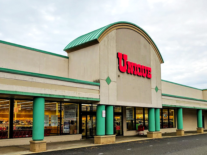 The green-trimmed façade with its bold red sign isn't just inviting shoppers – it's practically daring you to discover what treasures await inside.