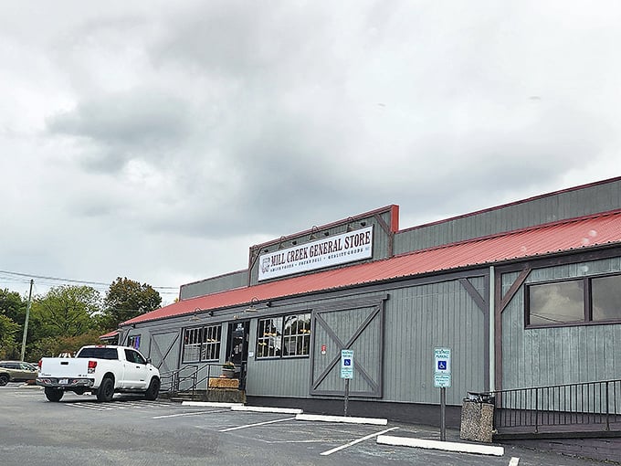 The unassuming exterior of Mill Creek General Store – where culinary treasures hide behind a humble façade that wouldn't look out of place in a Norman Rockwell painting.