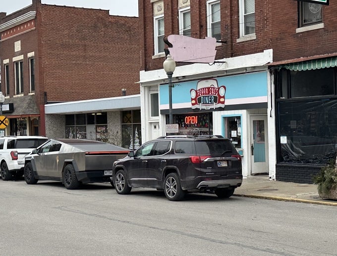 Welcome to Peggy Sue's, where the blue awning beckons like a retro beacon of breakfast bliss. Step inside and prepare for a time-warp to deliciousness!