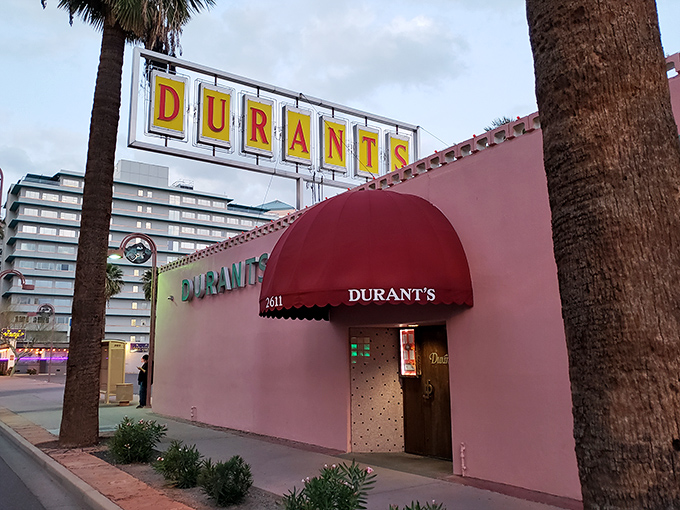 The iconic pink exterior of Durant's stands proudly on Central Avenue, a mid-century mirage in downtown Phoenix's urban landscape.