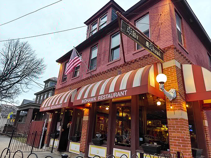 The iconic red-brick facade and striped awnings of The Old Mohawk aren't just charming—they're a beacon for sandwich pilgrims seeking salvation between two slices of bread.