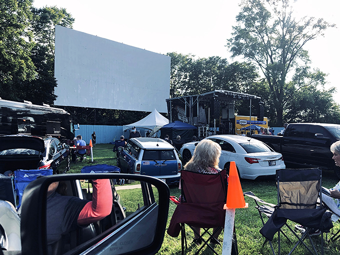 Cars lined up under the open sky, where the humble drive-in transforms ordinary evenings into cinematic adventures. Pure Americana at its finest.