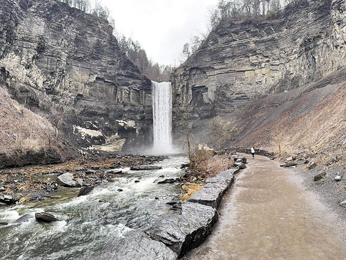 Mother Nature's grand amphitheater features a 215-foot waterfall plunging into a limestone basin—proof that New York's most impressive skyscrapers aren't all in Manhattan. 