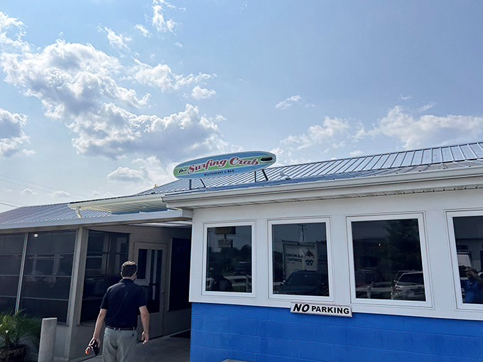 The blue exterior with its cheerful yellow surfboard sign isn't trying to impress anyone—until you taste what's inside. Coastal dining at its unpretentious best.