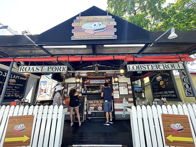 The white picket fence isn't keeping anyone out—it's corralling hungry seafood lovers into this Key West treasure where lobster rolls and happiness await.