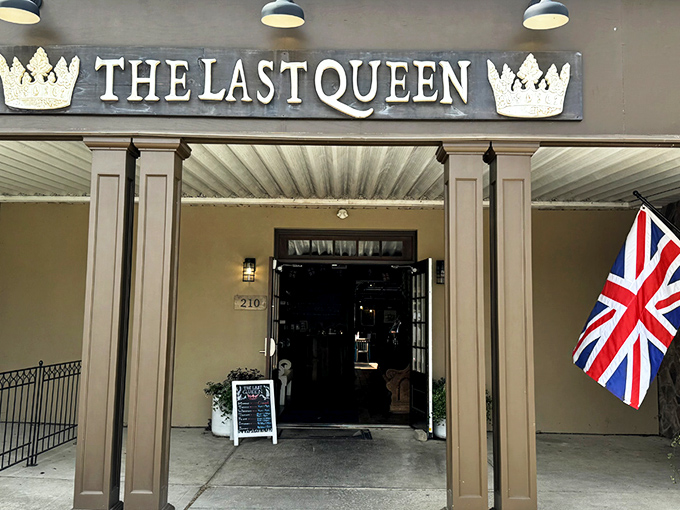 The Last Queen stands proudly in Enon, its stone facade and British flag promising an authentic pub experience that feels worlds away from Ohio cornfields.