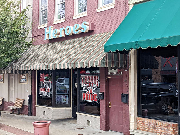 Heroes Restaurant & Pub stands like a culinary sentinel on Pine Street, its historic brick facade and turquoise sign promising comfort and satisfaction within.