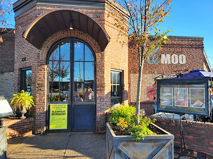 The brick façade of Le Moo welcomes hungry visitors like a carnivore's storybook cottage. Rustic charm meets upscale dining at Louisville's premier steakhouse destination.