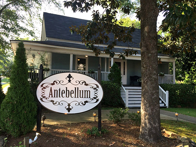 A Southern welcome if there ever was one. This charming white farmhouse with its inviting porch promises culinary magic within its historic walls.