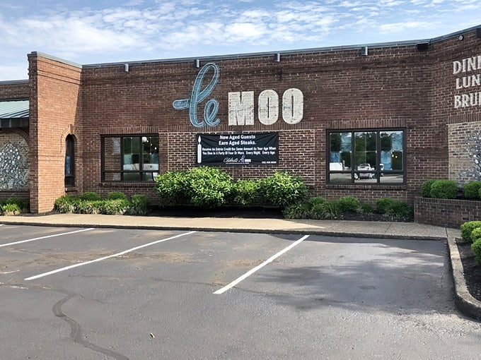 The brick façade of Le Moo welcomes hungry visitors like a carnivore's storybook cottage. Rustic charm meets upscale dining at Louisville's premier steakhouse destination.