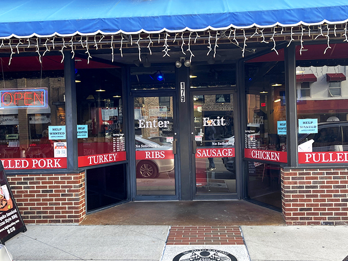 The neon "OPEN" sign at Big Tiny's isn't just an invitation—it's a siren call to barbecue pilgrims. Those colorful string lights aren't decorations; they're beacons of smoked meat salvation.