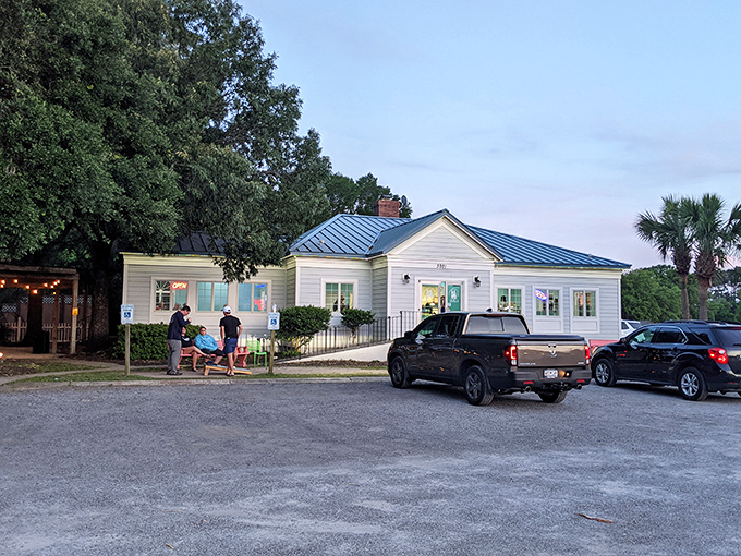 The charming white cottage with blue trim isn't just a pretty facade—it's the gateway to frozen nirvana at Stella's Homemade Ice Cream in Murrells Inlet.