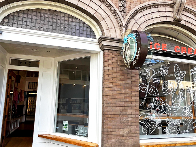 The architectural equivalent of "come hither" – Molly Moon's storefront beckons with its classic brick façade and neon glow, promising sweet relief from Seattle's bustling streets. 