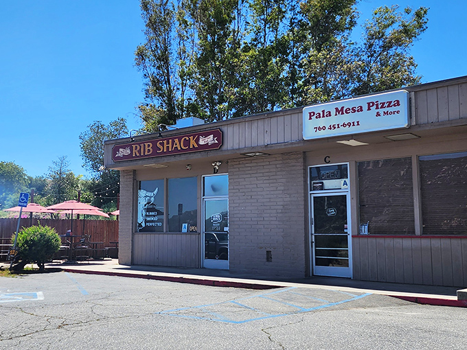 The unassuming storefront that houses barbecue greatness. Like finding a diamond in a strip mall, The Ribshack Que's modest exterior belies the smoky treasures within.