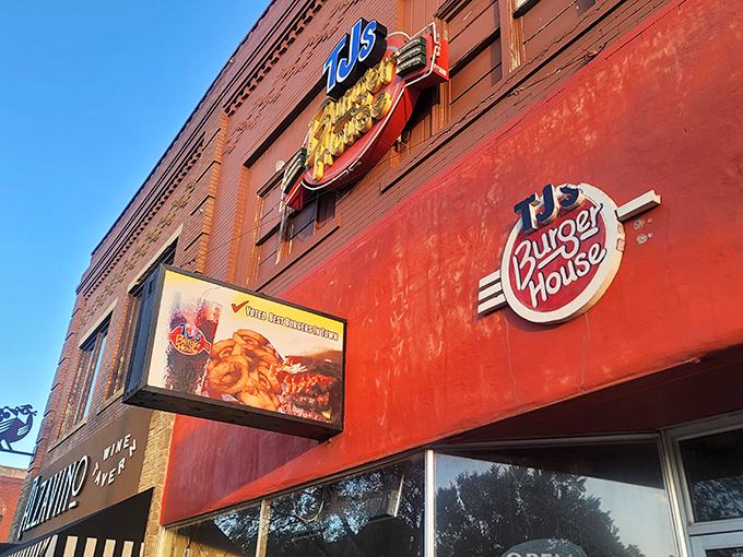 That iconic yellow and red sign against classic brick isn't just restaurant signage—it's a beacon of burger hope for hungry Kansans everywhere.