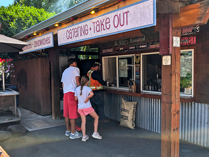 The rustic wooden exterior of Pine Shed Ribs isn't trying to impress anyone—until you smell what's cooking inside. Barbecue authenticity at its finest.