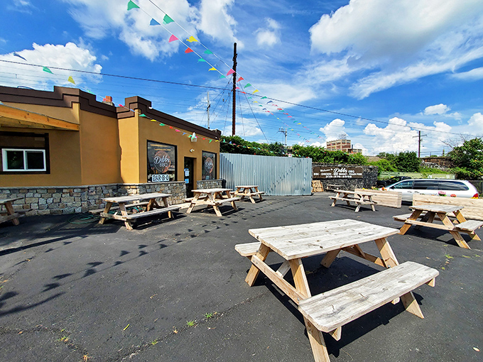 The modest yellow exterior of Dibbs BBQ doesn't scream for attention, but those colorful pennants are like smoke signals beckoning hungry travelers to barbecue paradise. 