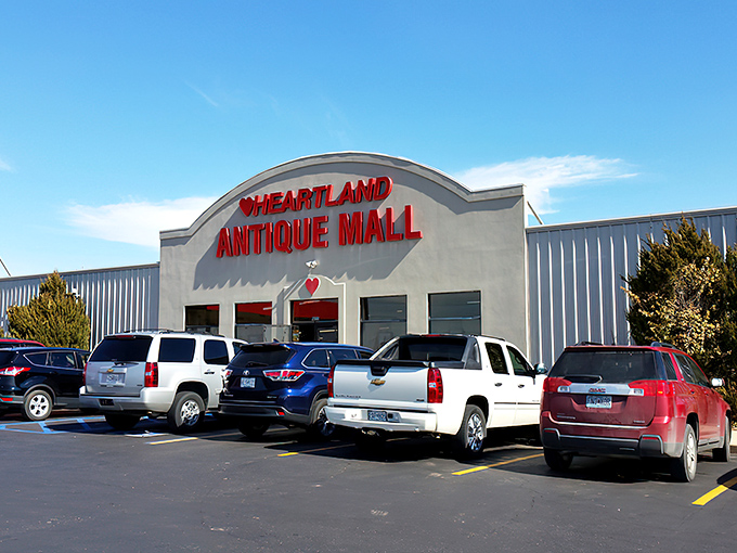 The bright red signage against a clear blue Missouri sky promises treasures within – your first clue that normal shopping rules don't apply here.
