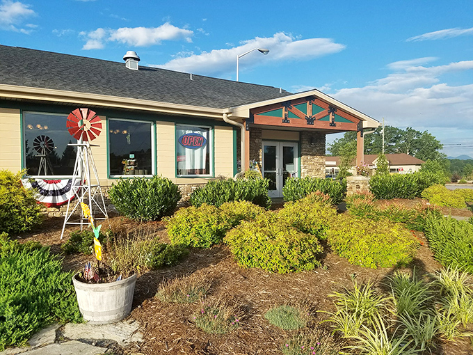 The welcoming façade of Moose Cafe in Asheville, where the landscaping is as thoughtfully prepared as the comfort food waiting inside.