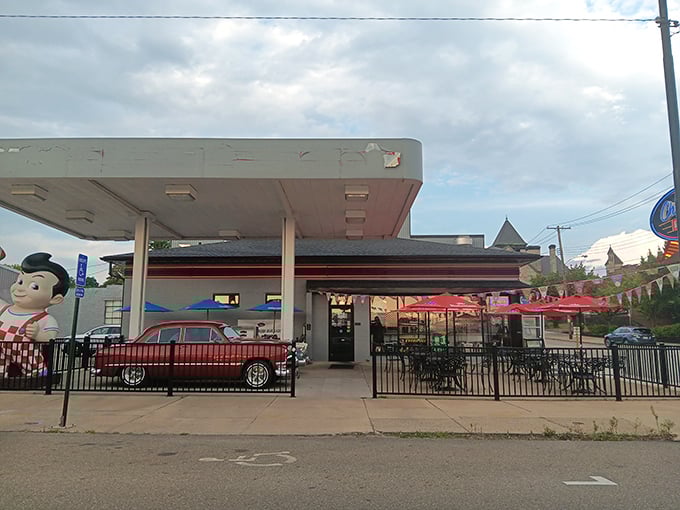The classic gas station-turned-diner exterior isn't just nostalgic—it's a promise that what awaits inside will fuel more than just your car.