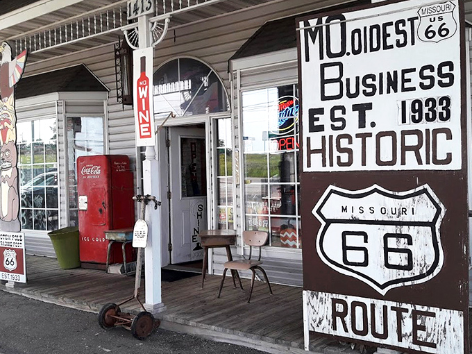 The weathered sign proclaiming "MO. OLDEST BUSINESS EST. 1933" isn't marketing spin—it's a time-travel invitation with a vintage Coke machine as your welcome committee.