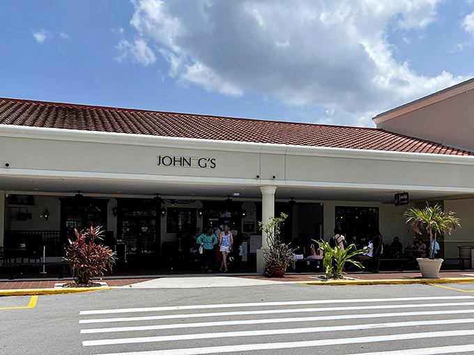 A simple white facade that belies the culinary treasures within—like finding a pearl in an unassuming oyster shell.