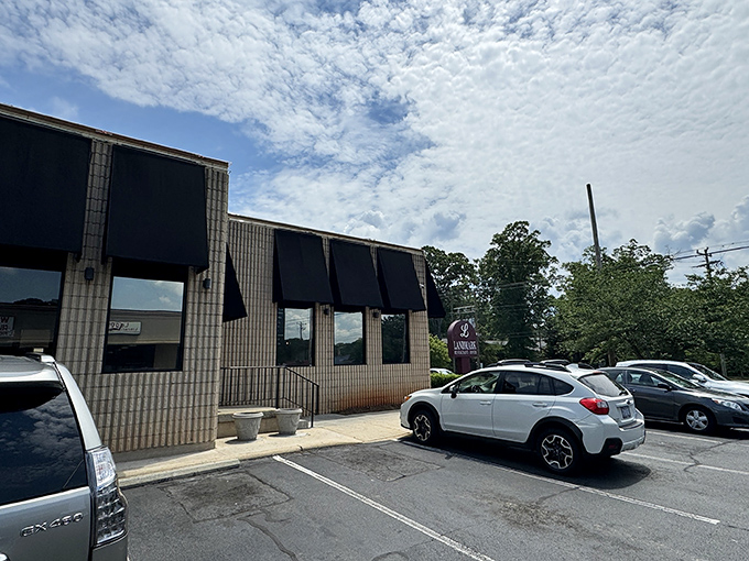 The unassuming exterior of Landmark Diner stands as Charlotte's culinary fortress – modest architecture hiding extraordinary flavors within.