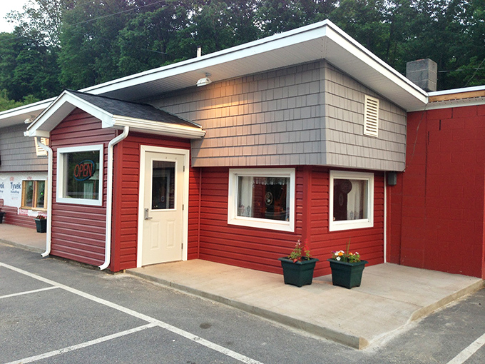 Welcome to flavor town! This cozy red exterior isn't just a diner, it's a portal to comfort food paradise.