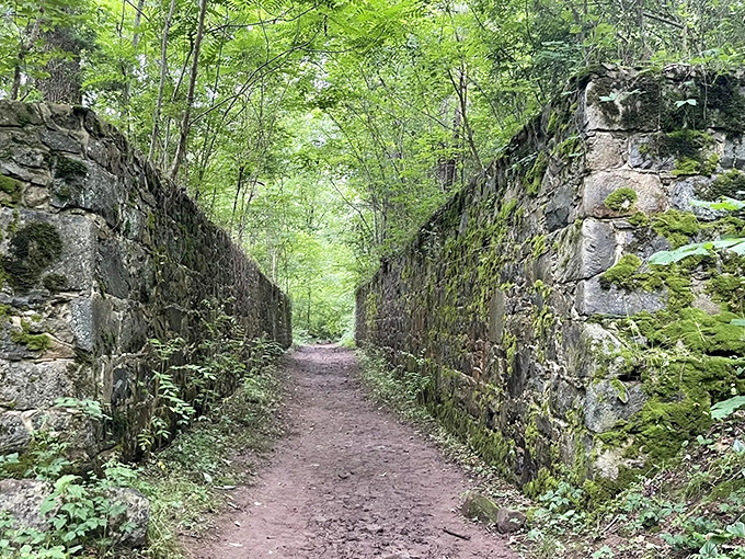 History flows between these ancient stone walls like whispers from the past—a perfect canal corridor for hikers and time travelers alike.