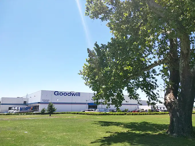 The unassuming exterior hides a treasure hunter's paradise inside. Like finding a secret portal to bargain heaven, this warehouse beckons with untold possibilities.
