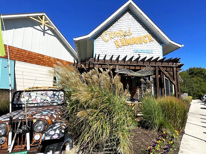Sunshine, blue skies, and that inviting coastal architecture – the Crooked Hammock's exterior practically whispers, "Your afternoon plans? They're right here."
