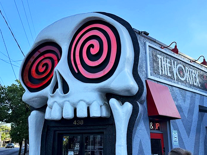 Enter if you dare! The Vortex's iconic skull entrance in Little Five Points isn't just photogenic—it's your portal to Atlanta's most deliciously rebellious dining experience.