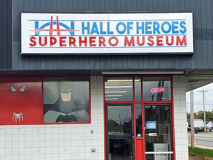 The unassuming exterior belies what waits inside - a façade featuring iconic superhero emblems that serve as a bat-signal to comic enthusiasts everywhere.