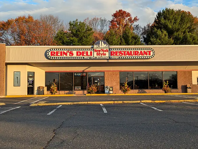 A neon beacon of deliciousness! Rein's Deli's sign promises New York-style eats that'll transport your taste buds faster than a subway ride to Manhattan.
